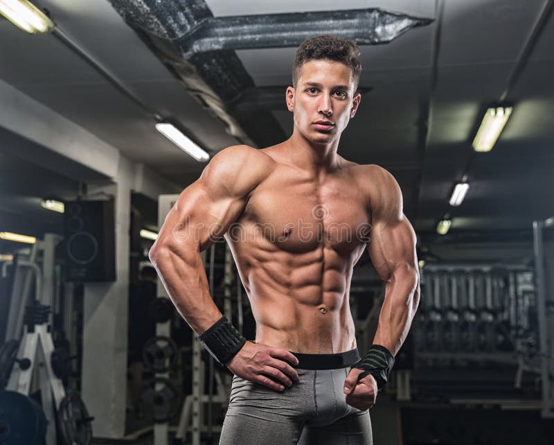 Strong and Handsome Young Man Doing Exercise with Dumbbells Stock Photo ...