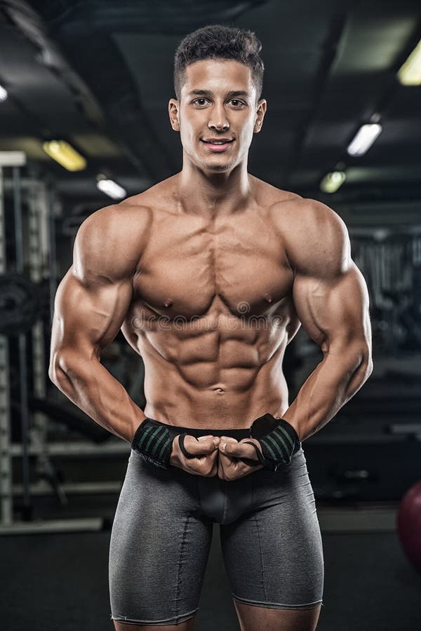 Strong and Handsome Young Man Doing Exercise with Dumbbells Stock Image ...