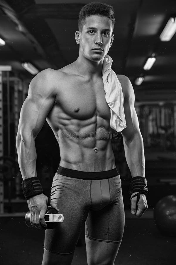 Strong and Handsome Young Man Doing Exercise with Dumbbells Stock Photo ...