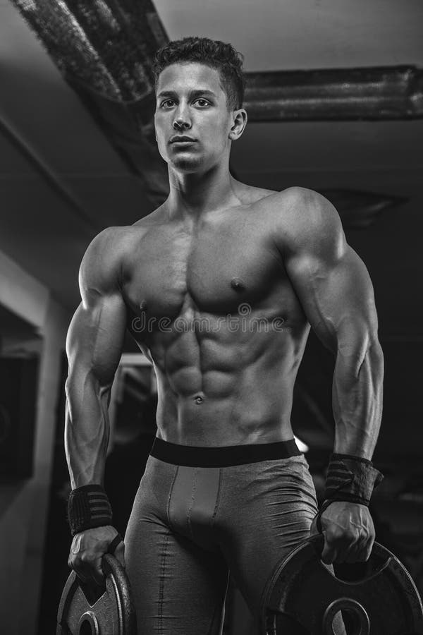 Strong and Handsome Young Man Doing Exercise with Dumbbells Stock Photo ...