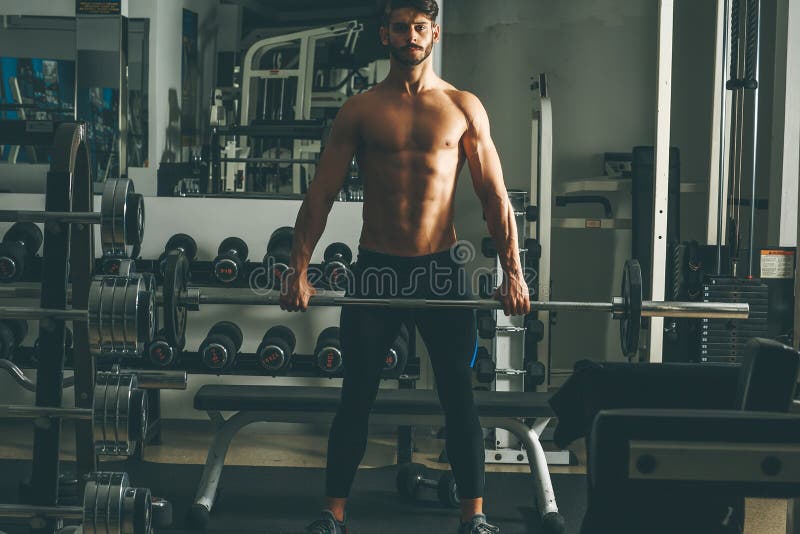Strong and Handsome Young Man Doing Exercise with Dumbbells Stock Photo ...