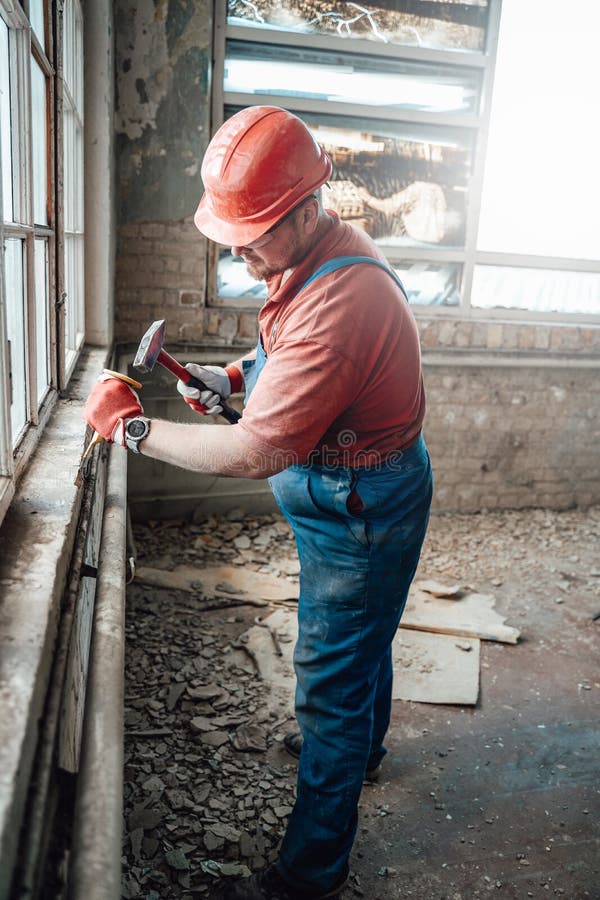 Strong Highly Skilled Worker Handling a Windowsill on a Large ...