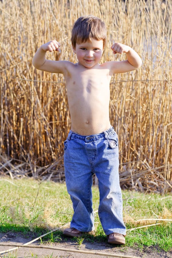 Strong Kid Showing the Muscles Stock Photo - Image of childhood, body ...