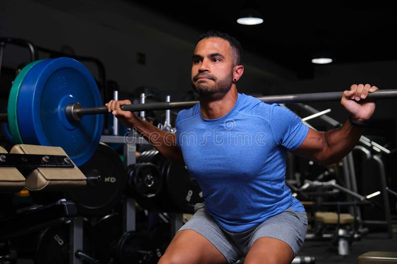 Strong Latin Man Squat Weightlifting at a Gym. Stock Image - Image of ...