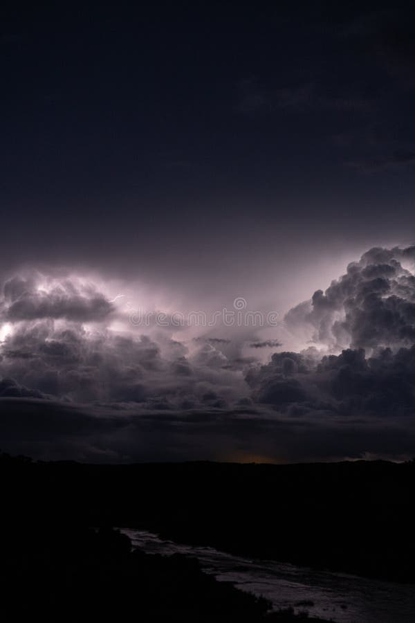 Strong Lightning in and Behind Big Towering Thunderclouds Stock Photo ...
