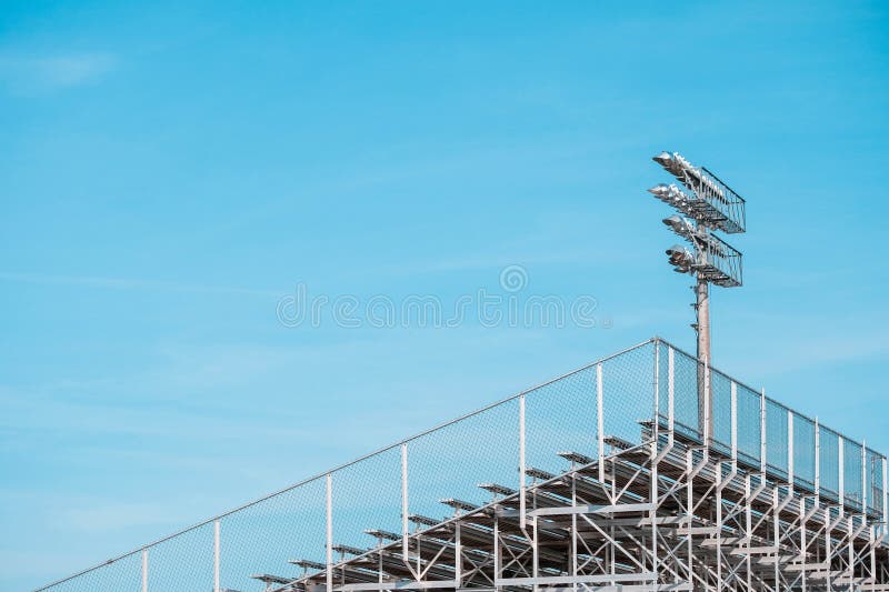 Strong Lights and Empty Bleachers at Sporting Venue Stock Image - Image ...