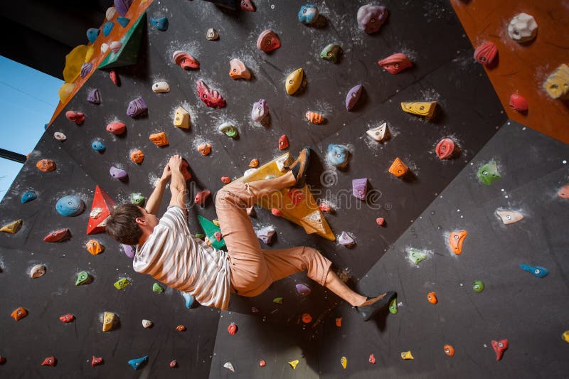 Strong Male Climber on Boulder Climbing Wall Indoor Stock Image - Image ...