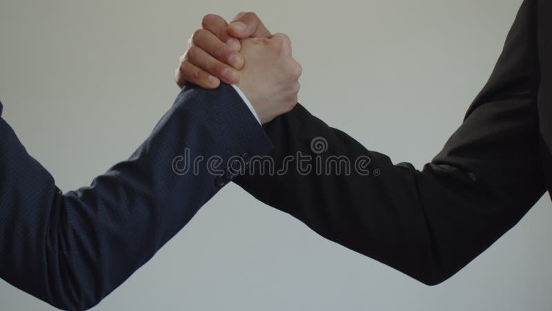 Strong Male Friendly Handshake. Hands in Business Suits on a White ...