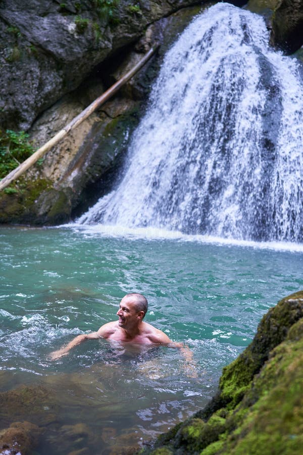 Strong Man Bathing in a Waterfall Stock Photo - Image of moss, jungle ...