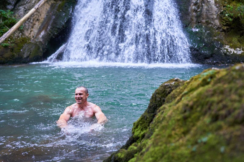 Strong Man Bathing in a Waterfall Stock Image - Image of landscape ...