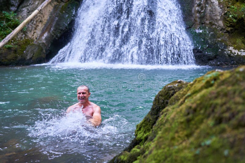 Strong Man Bathing in a Waterfall Stock Photo - Image of outdoors ...