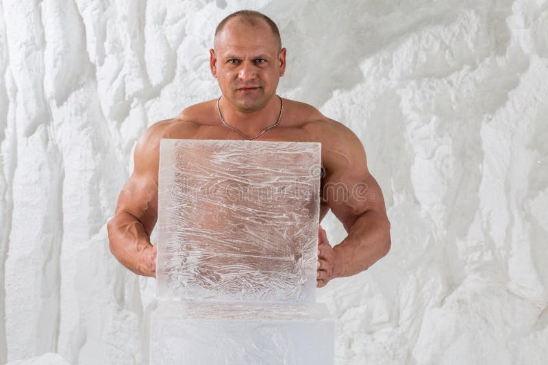 A Strong Man with Big Muscles in Studio with Ice Stock Photo - Image of ...