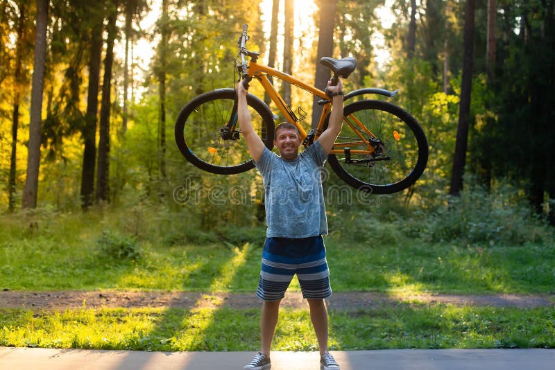 Strong Man on a Bike in the Park Stock Image - Image of cycling, park ...