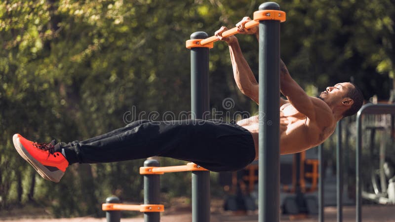 Strong Man Doing Statics Exercise on Horizontal Bar Stock Photo - Image ...