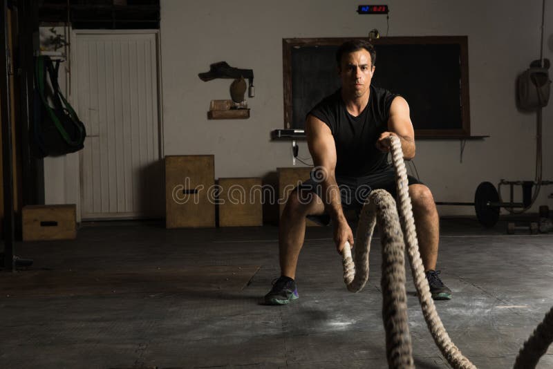 Strong Man Exercising with Battle Ropes Stock Photo - Image of strong ...