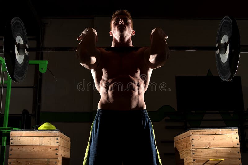 Strong Man Exercising in Dramatic Light Stock Image - Image of personal ...