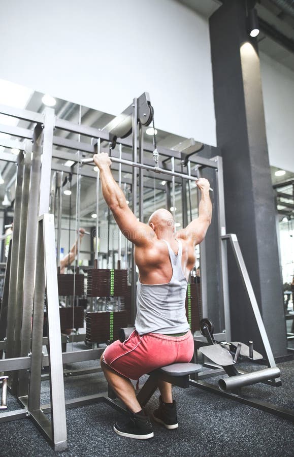 Strong Man Exercising in Gym. Routine Workout for Physical and Mental ...