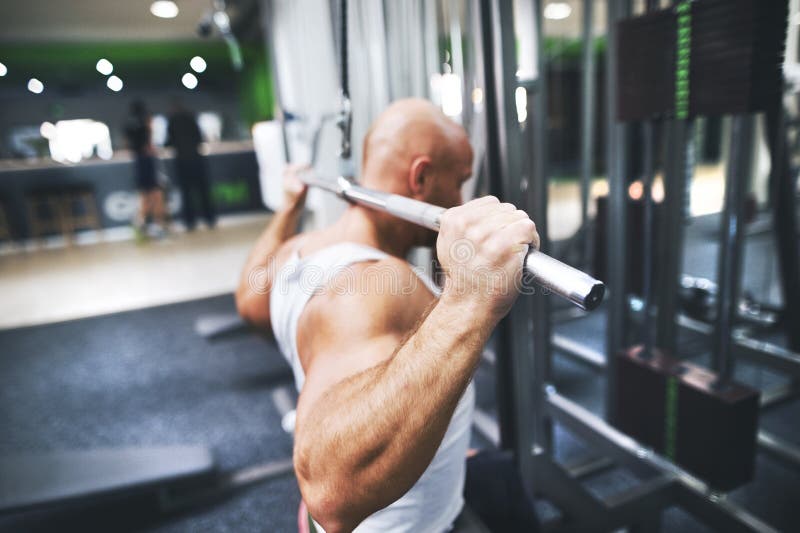 Strong Man Exercising in Gym. Routine Workout for Physical and Mental ...
