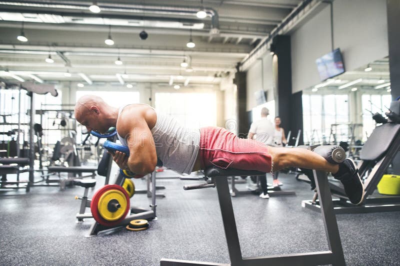 Strong Man Exercising in Gym. Routine Workout for Physical and Mental ...