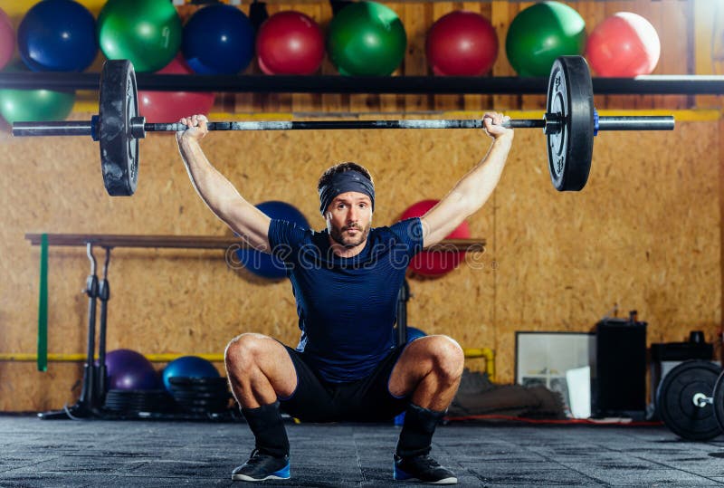 Strong man in the gym stock photo. Image of beautiful - 154956284