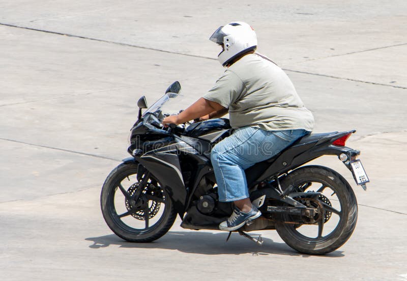 Strong Man with a Helmet Rides a Sport Motorcycle Stock Photo - Image ...