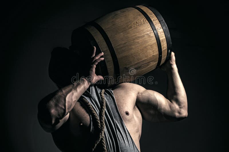 Strong Man Holds Barrel Isolated on Black. Stock Photo - Image of board ...