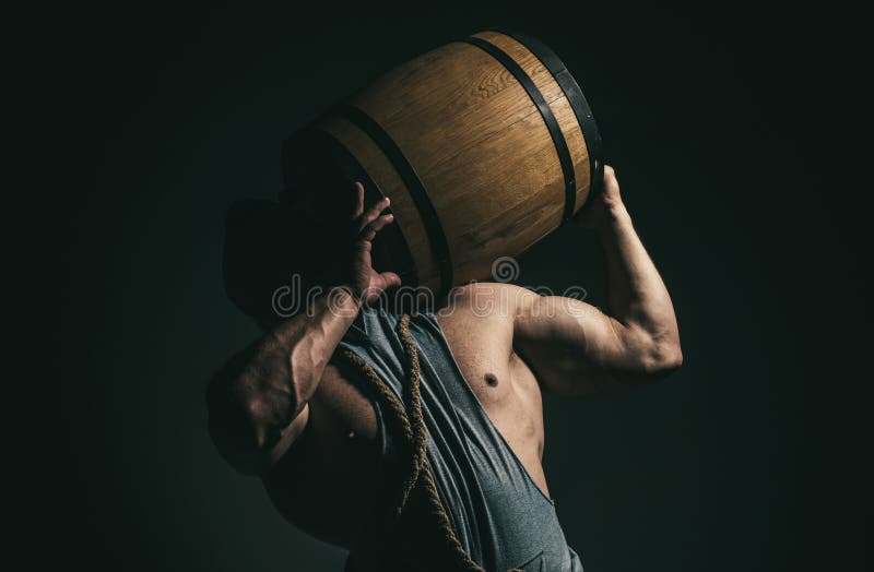 Strong Man Holds Barrel Isolated on Black. Stock Photo - Image of power ...