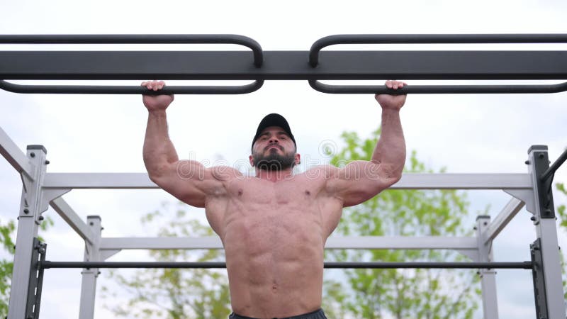 Strong Man Making Pull Ups during Outdoor Training Workout Fitness ...