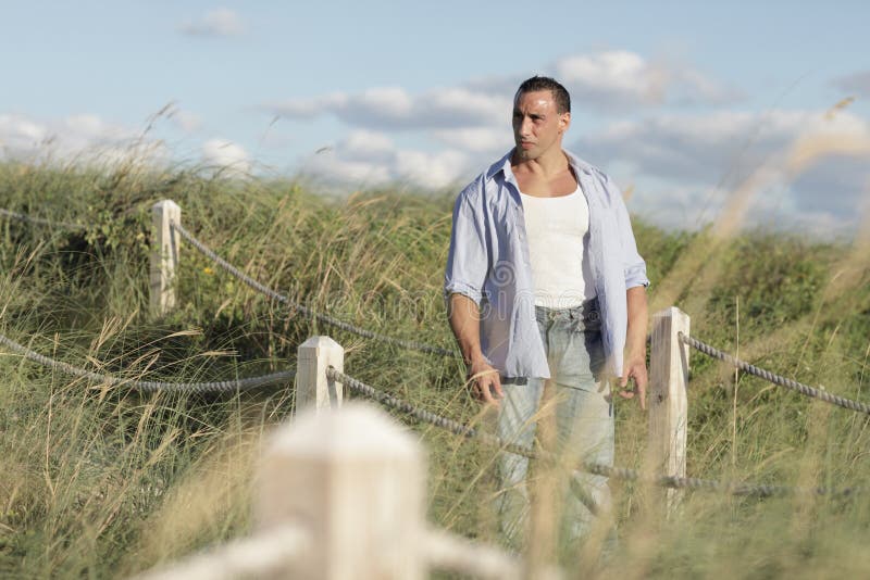 Strong man in nature stock image. Image of male, horizontal - 17832991