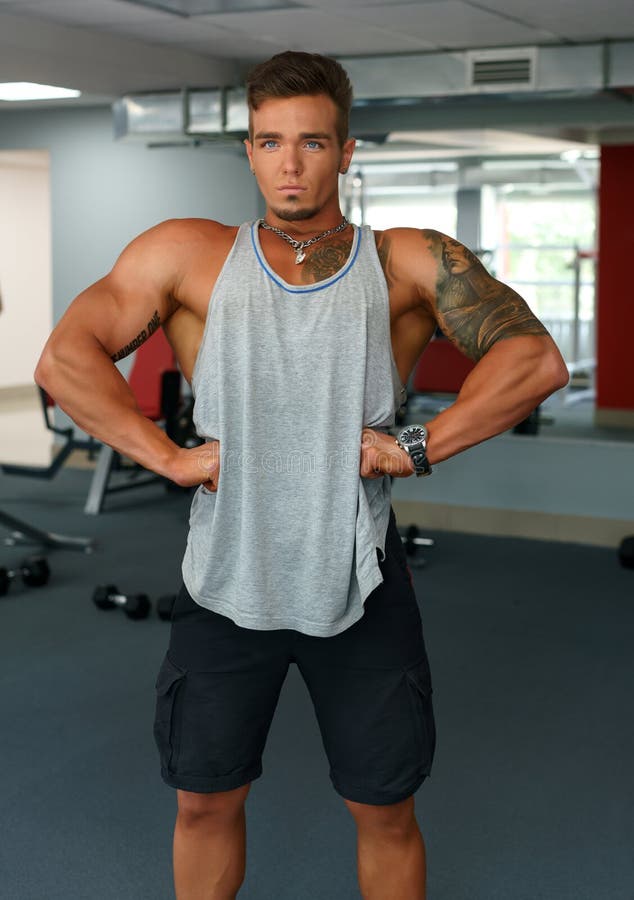 Strong Man Posing with His Muscles Straining Stock Image - Image of ...