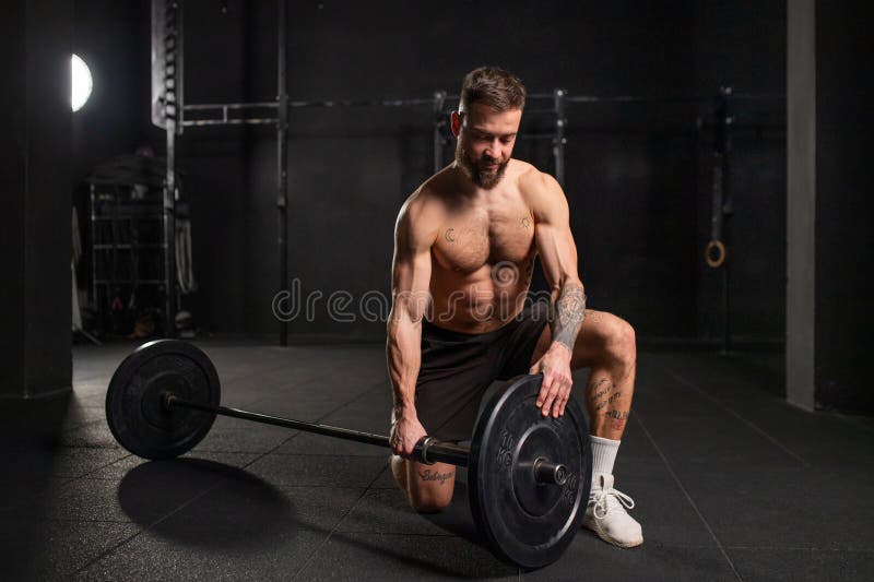 Strong Man Preparing for Barbell Lift, Changing Plates, Loading Barbell ...