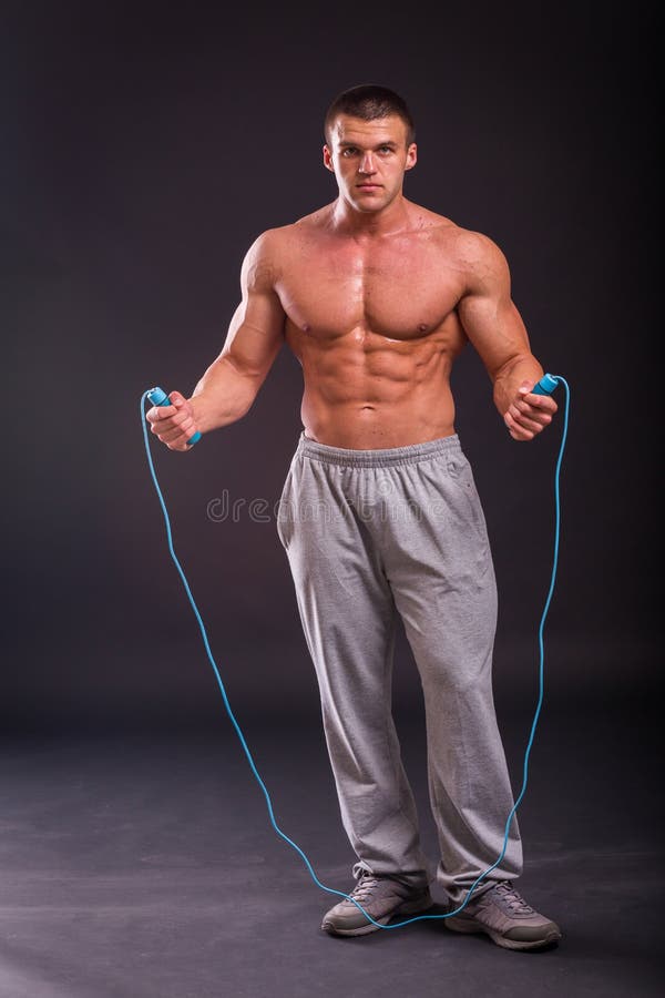 A strong man with a rope stock image. Image of dumbbell - 52762249