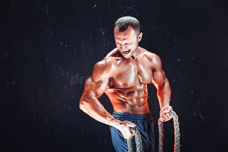 Strong man with rope stock photo. Image of lifestyle - 101422396