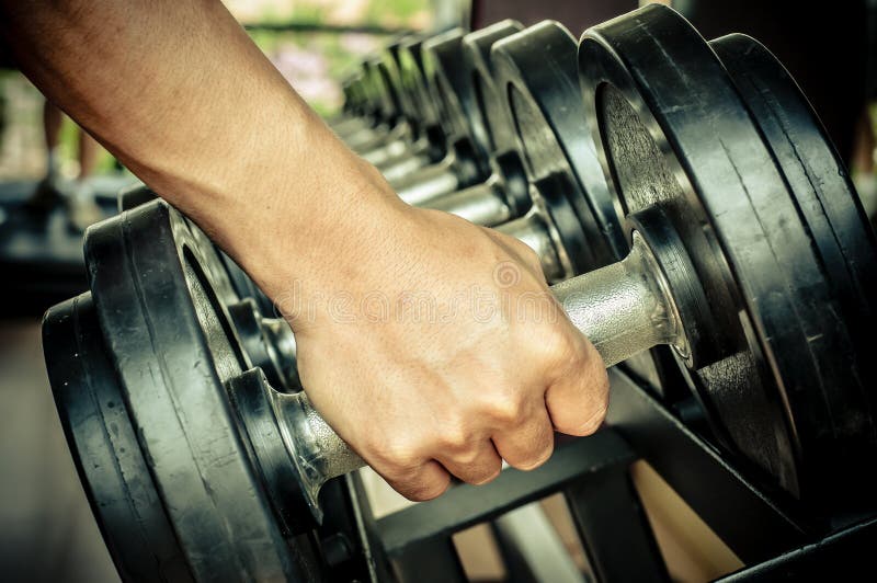 Strong Man S Hand Takes a Heavy Dumbbell Stock Photo - Image of indoors ...