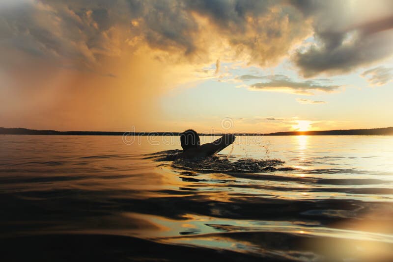 Strong Man is Sailing into the Sunset. Lens Flare Effect Stock Photo ...