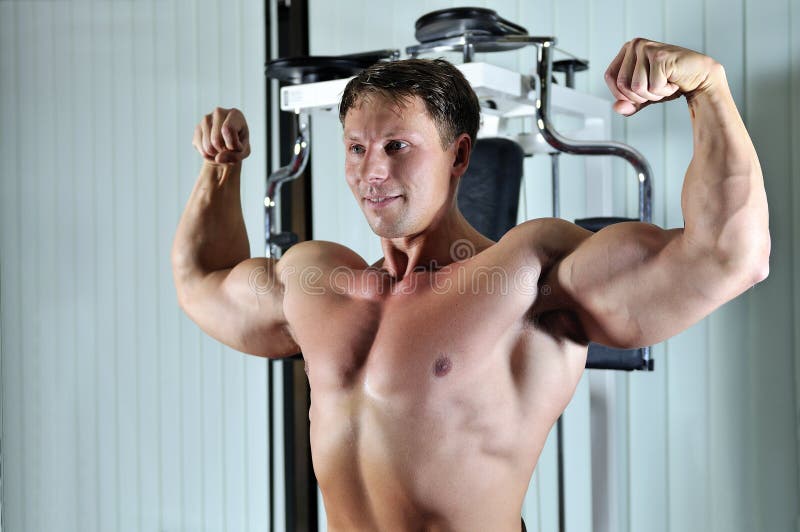 Strong man work out in gym stock image. Image of metal - 7078813