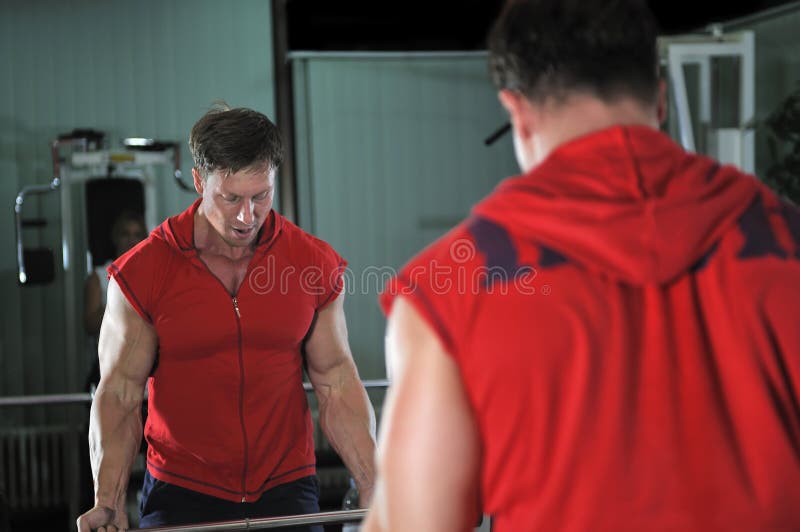 Strong man work out in gym stock image. Image of metal - 7078813