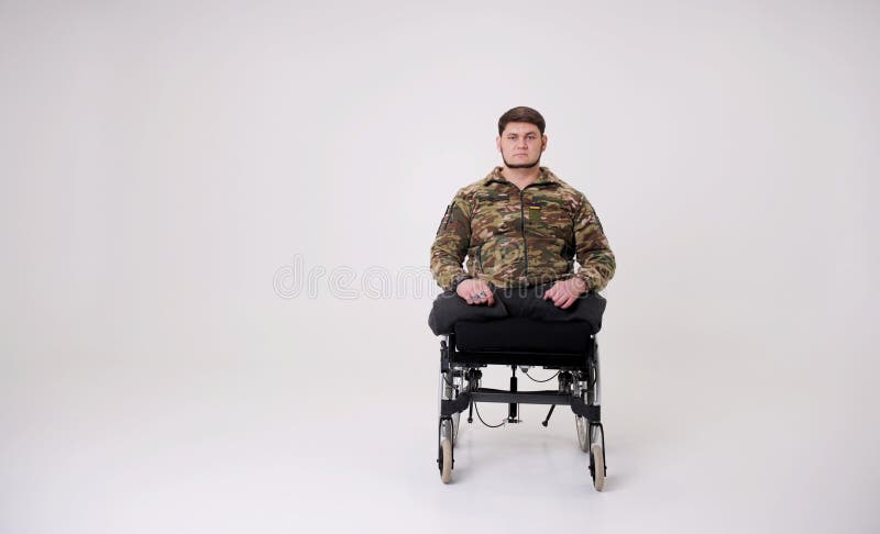 Strong Military Man in a Chair without Limbs Prosthetics Stock Photo ...