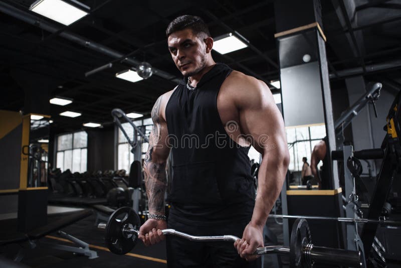 Muscular Bodybuilder Working Out at Gym Stock Image - Image of muscles ...