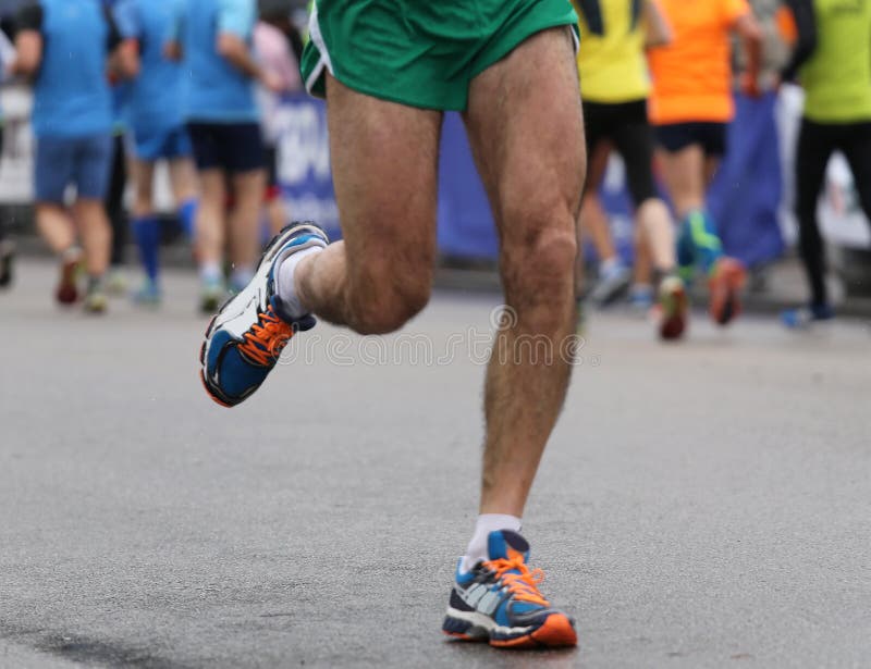 Muscular Legs of the Fast Runner during the Cross Country Race Stock ...