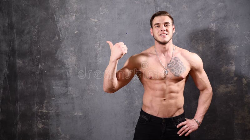 Strong and Muscular Man Bodybuilder. Man Posing on a Black Background ...