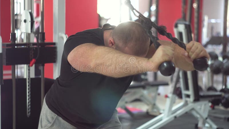 Strong Muscular Man Does Different Kind of Exercises in the Gym Stock ...