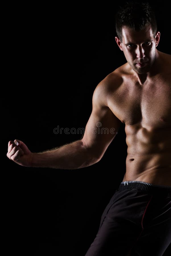 Strong Muscular Man Posing on Black Stock Image - Image of healthy ...