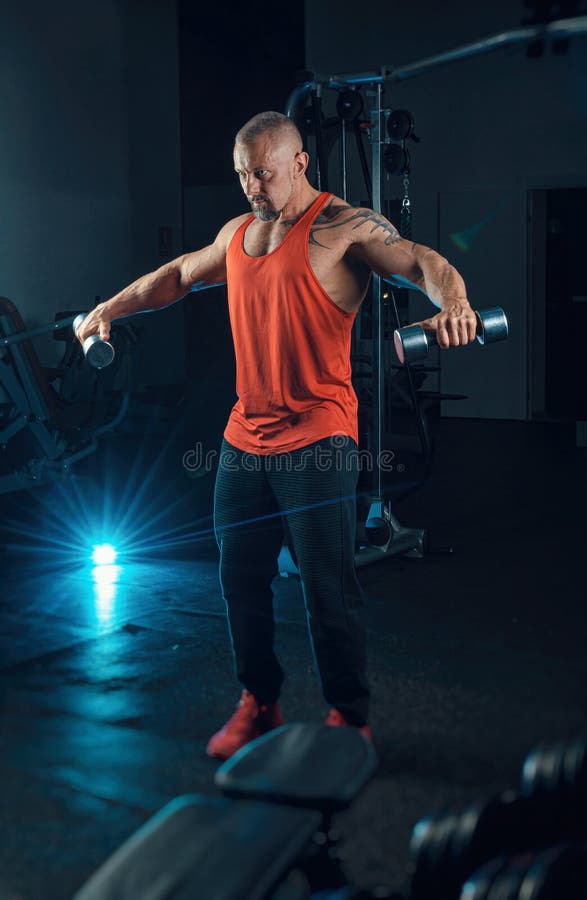 Strong Muscular Man Trains in the Gym Stock Image - Image of person ...