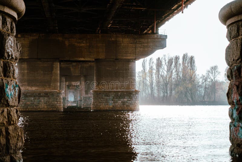 Strong Pillars of the Bridge Over the River Stock Image - Image of ...