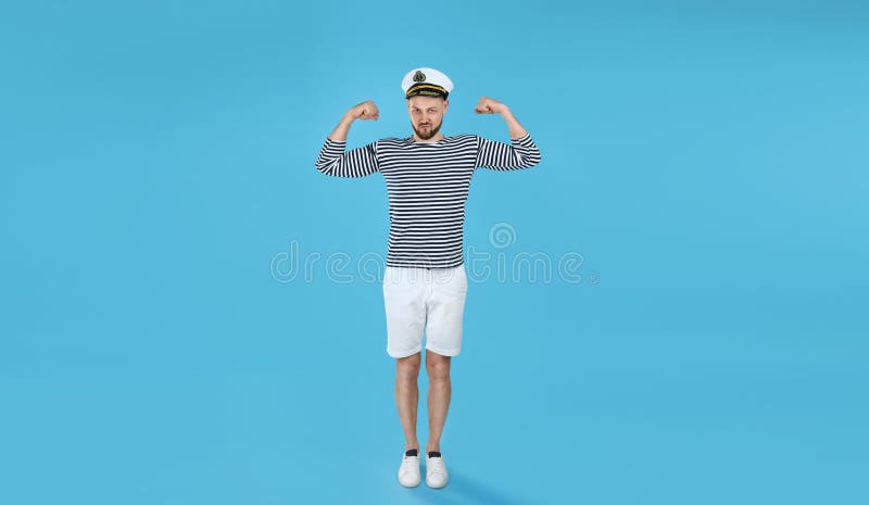 Strong Sailor Showing Biceps on Light Blue Background Stock Photo ...