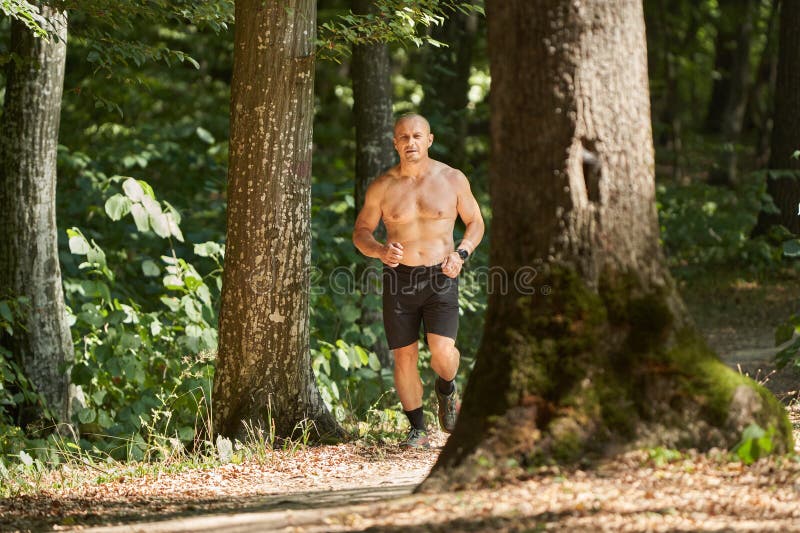 Shirtless Trail Runner in the Forest Stock Photo - Image of jogging ...