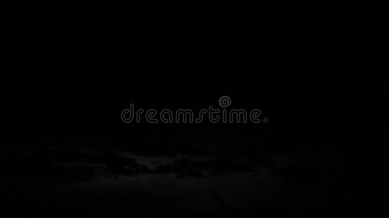 A Strong Thunderstorm with Lightning in the Clouds. Night Sky during a ...