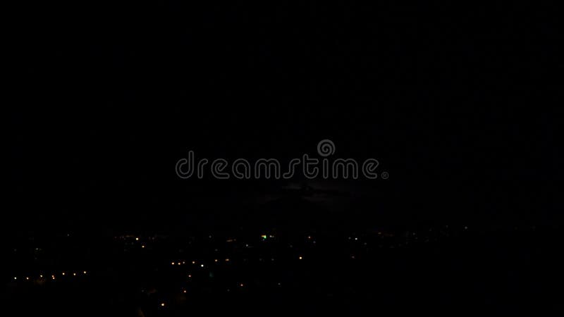 A Strong Thunderstorm with Lightning in the Clouds. Night Sky during a ...