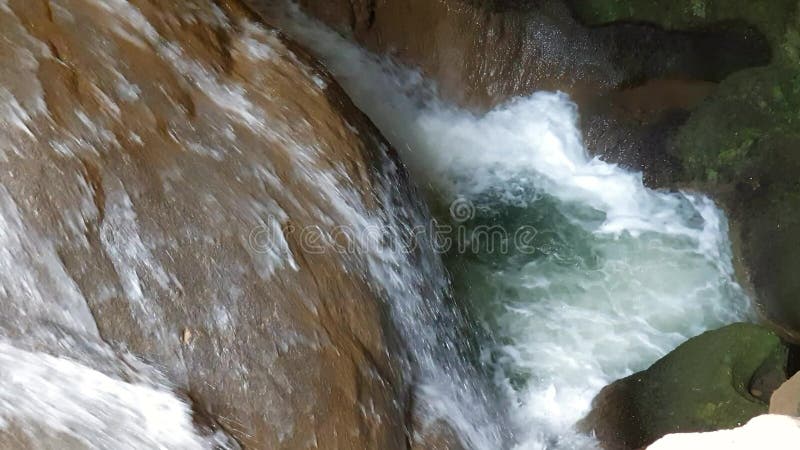 Strong Water Flow in the Cave. a Small Waterfall Underground Stock ...
